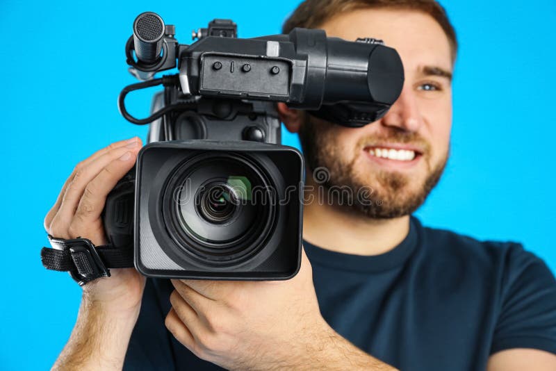 Operator with Professional Video Camera on Blue Stock Image - Image of ...