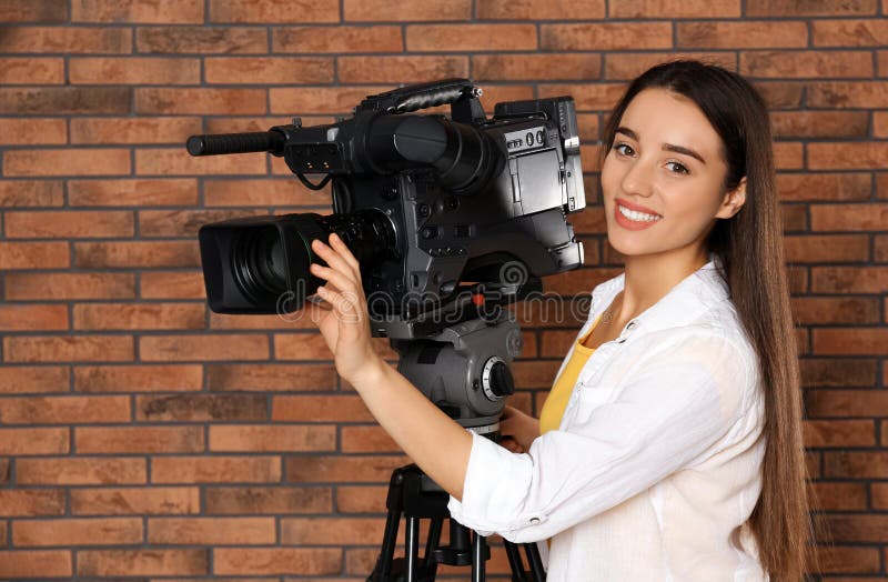 Operator with Professional Video Camera Near Wall Stock Image - Image ...