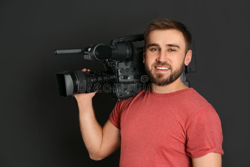 Operator with Professional Video Camera on Black Background Stock Image ...