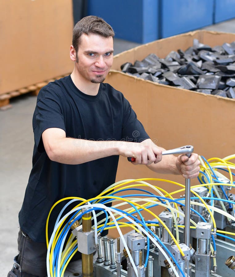 Operator Repairs a Machine in an Industrial Plant with Tools - P Stock ...