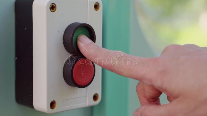 Operator S Hand Presses the Green Switch-on Button on Control Panel ...
