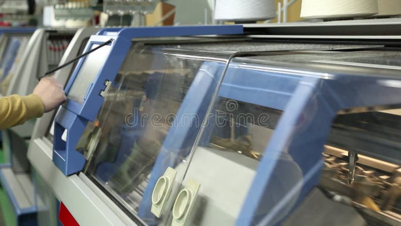 The Operator Sets Up a Modern Digital Knitting Machine. Stock Video ...