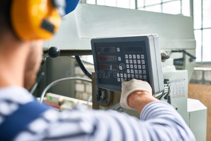 Factory Operator Working On Control Panel Of Manufacturing Machi Stock ...