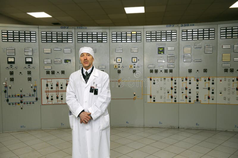 Operator Standing in Front of the Main Control Board at the Control Operations Room. Chornobyl ...