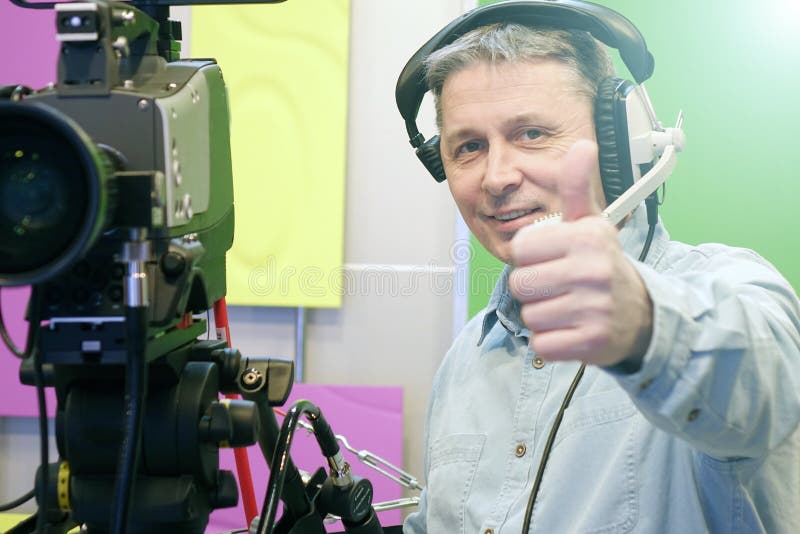 Camera Operator Working with a Cinema Broadcast TV Camera Stock Photo ...