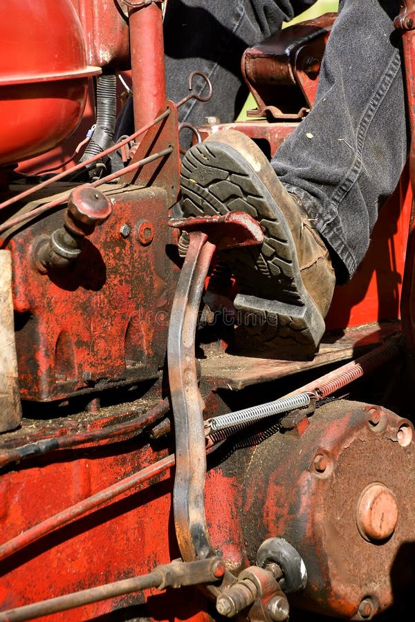 An Operator of a Tractor is Holding the Clutch in a Depressed Setting ...