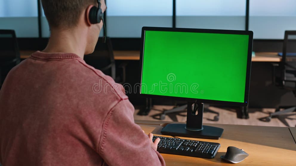 Operator Using Chromakey Computer at Workplace Closeup. Green Screen ...