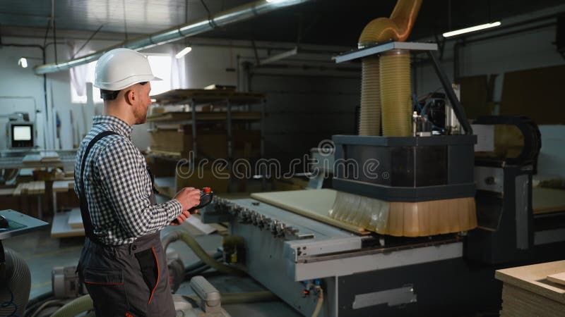 Operator Using CNC Router To Cut Wooden Panel Stock Footage - Video of ...