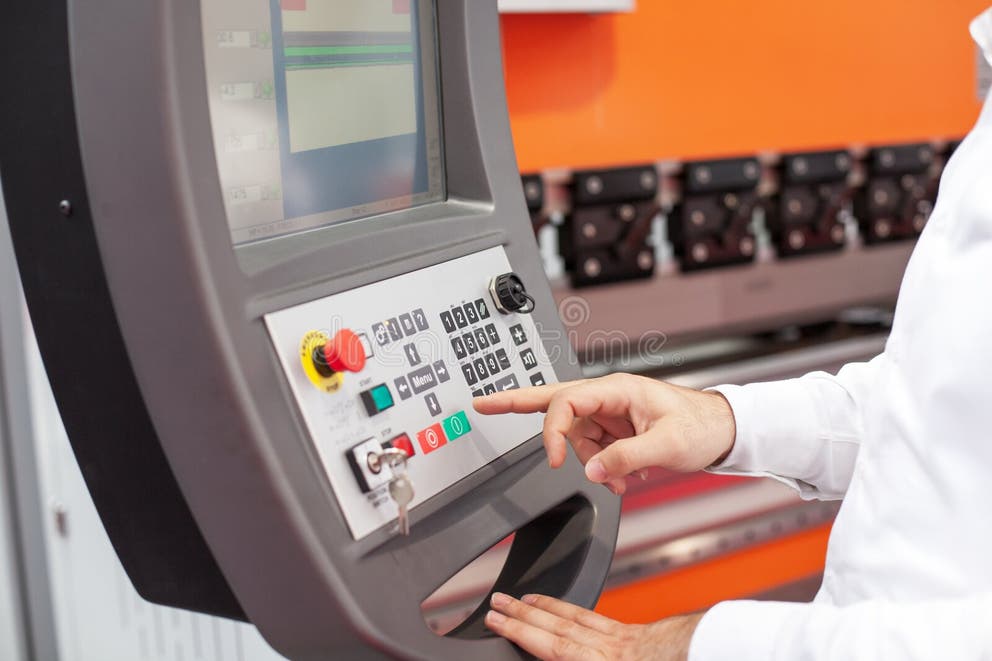 Operator Using an Industrial CNC Machine Control Panel with Precision ...
