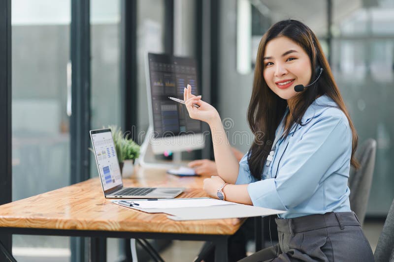 Operator Wearing a Headset, Using a Dashboard on Laptop for Data ...