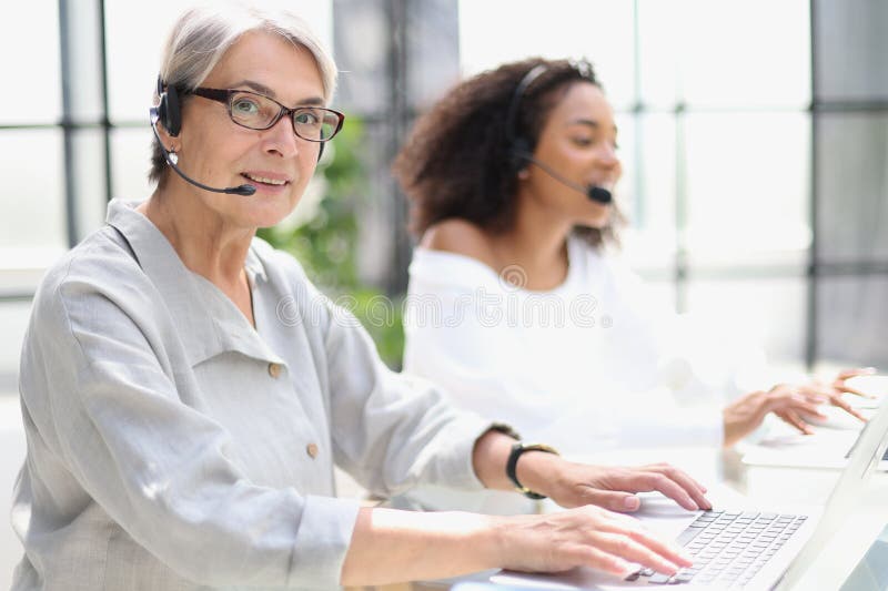 Operator Woman Agent with Headsets Working in a Call Centre. Stock ...
