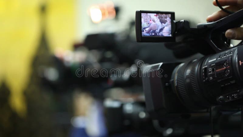 Operator Zoom in Camera and Rotate it, Video Shown Stock Video - Video ...