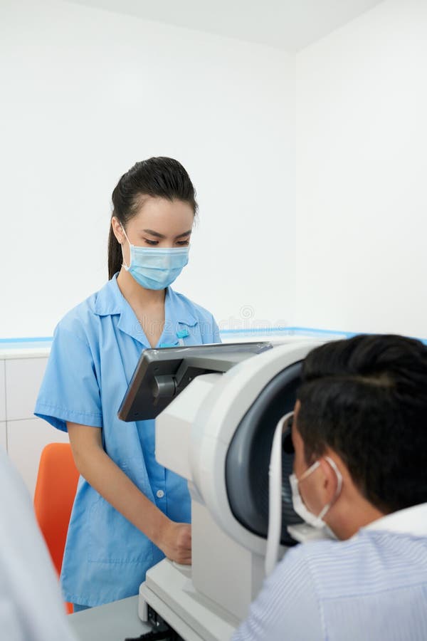 Ophthalmic Nurse Setting Refractometer Stock Image - Image of ...