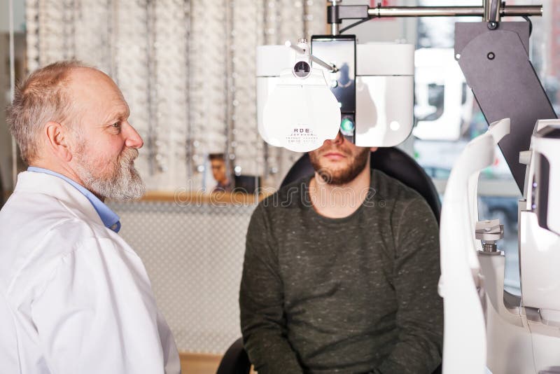 Ophthalmologist and Beautiful Patient in Optical Store Stock Photo ...