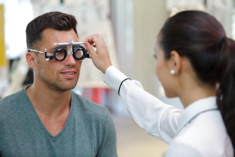 Ophthalmologist Trying Different Lenses during Eye Test Stock Photo ...