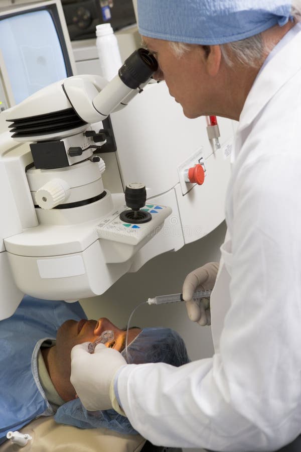 Opthamologist Performing Laser Eye Treatment Stock Photo - Image of ...