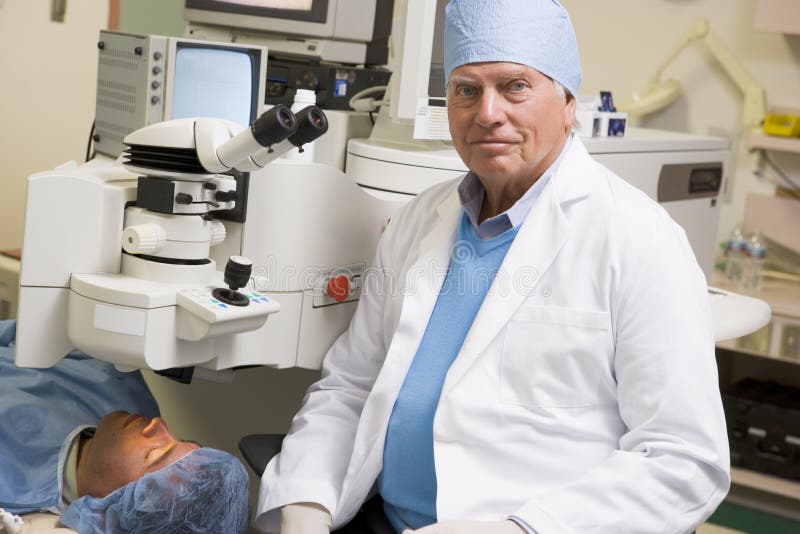 Opthamologist Performing Laser Eye Treatment Stock Photo - Image of ...