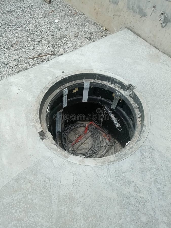 Optical Cable in a Plastic Communication Well on a Concrete Sidewalk ...