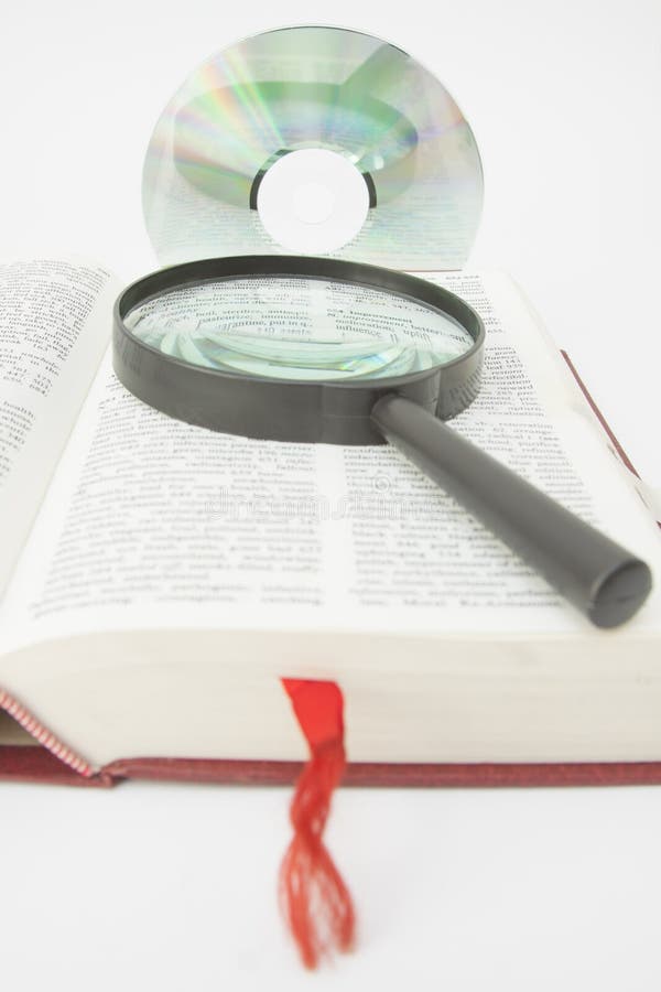 Optical Disc, Magnifying Glass on a Book Page Stock Photo - Image of ...