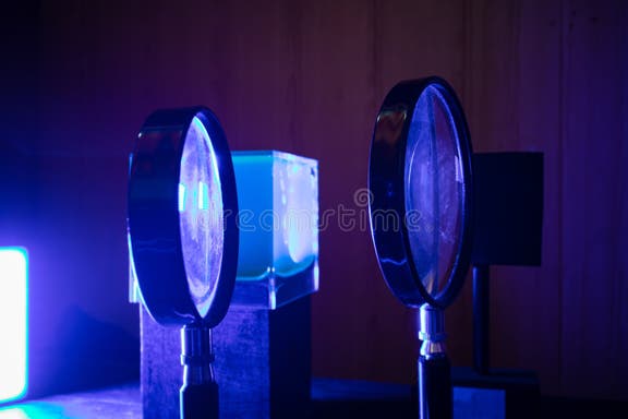 Optical Lenses on Stands in Blue Light in Laboratory Stock Photo ...