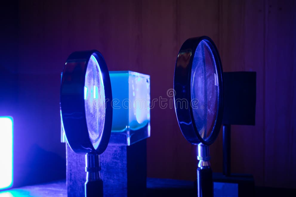 Optical Lenses on Stands in Blue Light in Laboratory Stock Photo ...