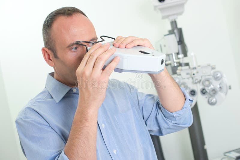 Optician Checking Vision Machine Stock Photo - Image of sight, examine ...