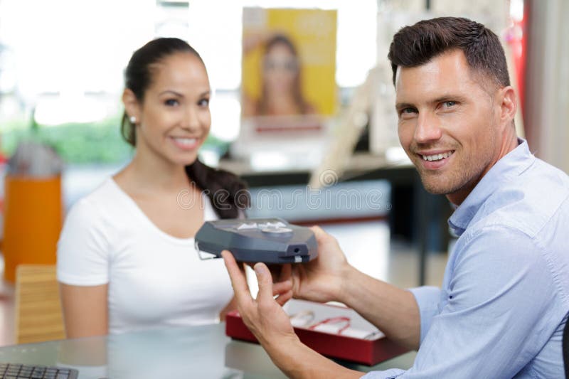 Optician Checks Eyes Client Stock Photo - Image of coat, eyecare: 276073200