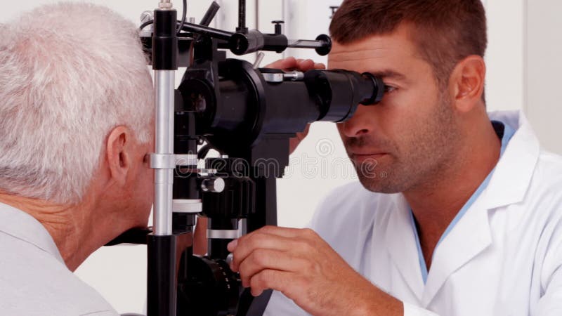 Optician Examining a Patients Eyes Stock Footage - Video of examining ...