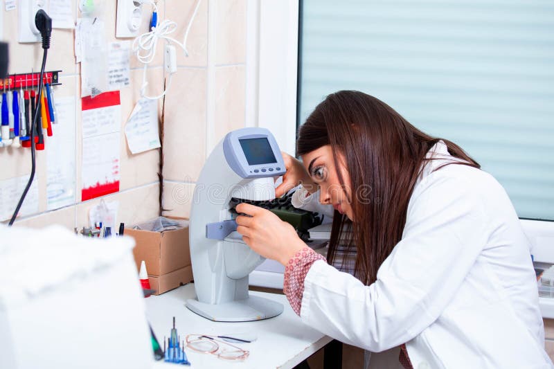 Optician Repairing Spectacles with Tool in Optical Store Stock Photo ...