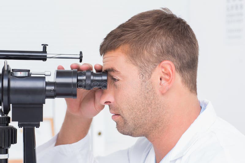 Optician Using Slit Lamp in Clinic Stock Photo - Image of instrument ...