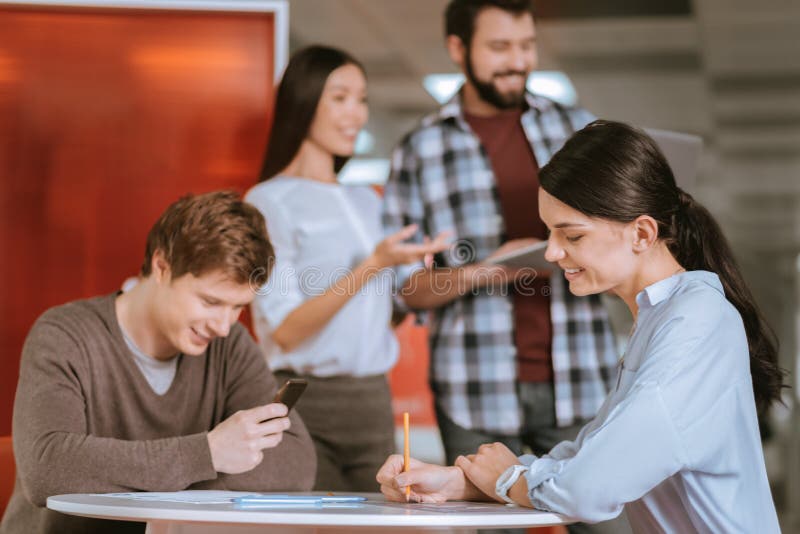 Optimistic Female Colleague Writing Plan Stock Image - Image of ...