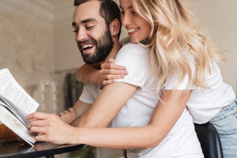 Optimistic Loving Couple Reading Book Stock Photo - Image of indoor ...
