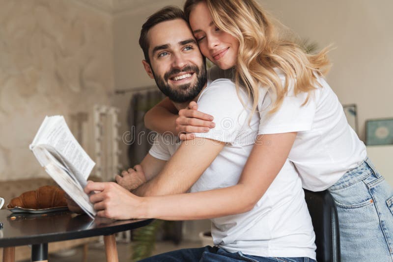 Optimistic Loving Couple Reading Book Stock Photo - Image of indoor ...