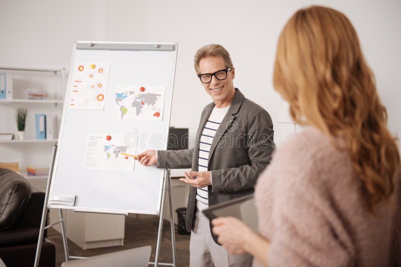 Optimistic Mature Businessman Representing Management Project in the ...