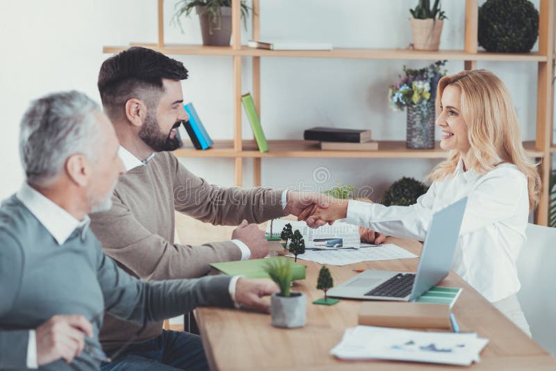 Optimistic Three Colleagues Becoming Partners Stock Image - Image of ...