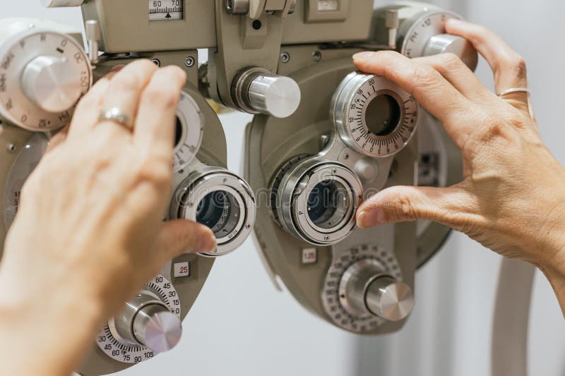 Optometrist Adjusting Trial Frame for Eye Examination Stock Photo ...