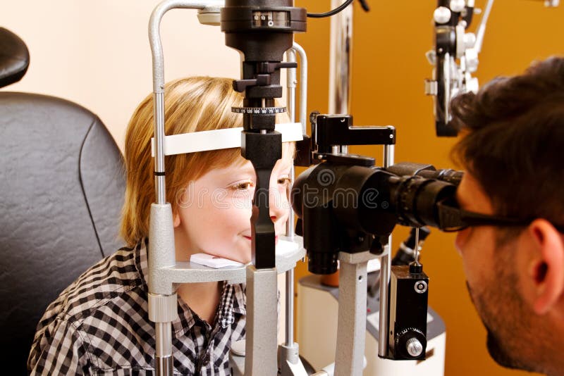 Checking the Child`s Vision. Optometrist Examines a Patient S Boy with ...