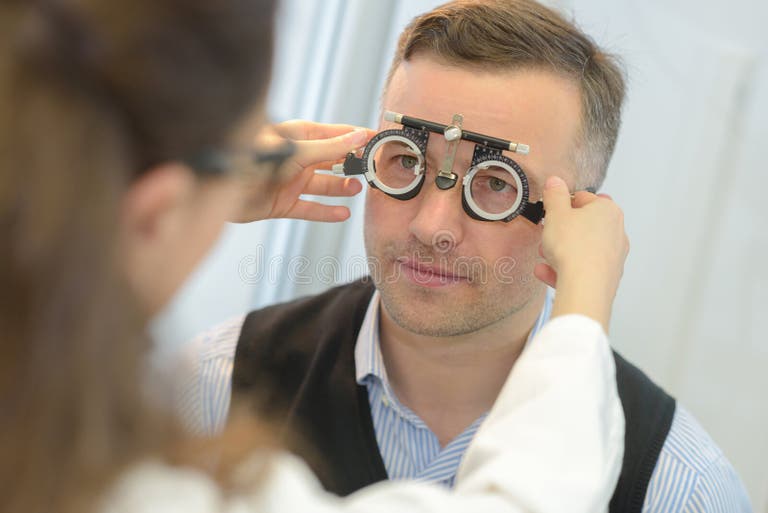 Optometrist Checking Male Patient Vision with Trial Frame Stock Image - Image of optomoetrist ...