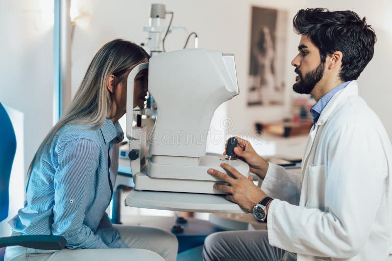 Optometrist Checking Patient Eyesight and Vision Correction Stock Image ...
