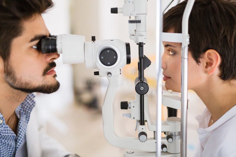 Optometrist Checking Patient Eyesight and Vision Correction Stock Image ...