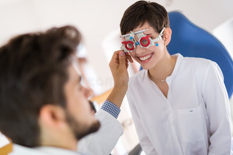 Optometrist Checking Patient Eyesight and Vision Correction Stock Image ...