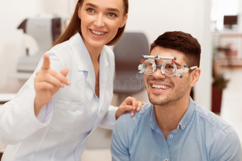 Optometrist Checking Patients Vision with Trial Frame Stock Image ...