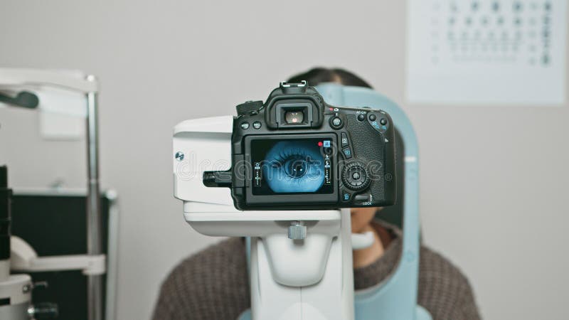 Optometrist Conducting Eye Examination Utilizing Specialized Camera ...