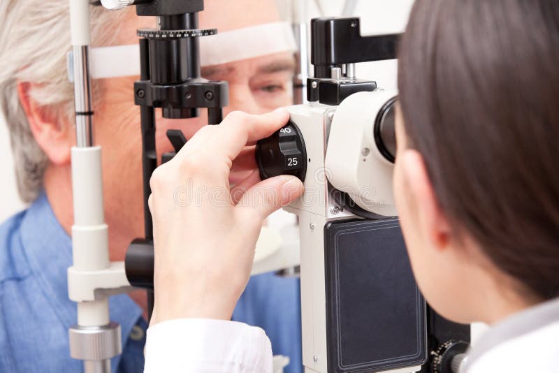 Optometrist Doing Sight Testing Stock Image - Image of microscope ...