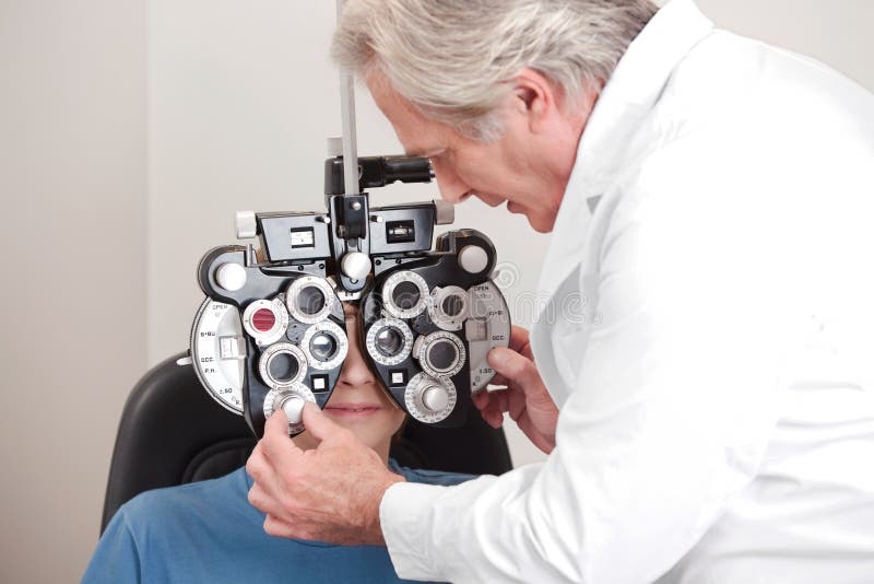 Optometrist Doing Sight Testing Stock Photo - Image of room, optometry ...