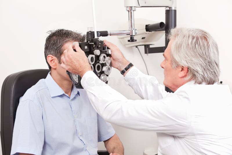 Optometrist Doing Sight Testing Stock Photo - Image of look, equipment ...