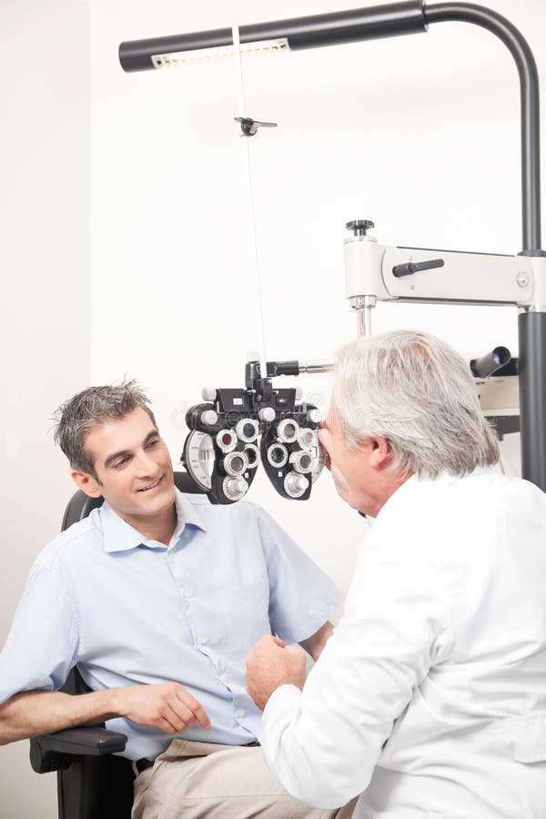 Optometrist Doing Sight Testing Stock Image - Image of patient, mature ...