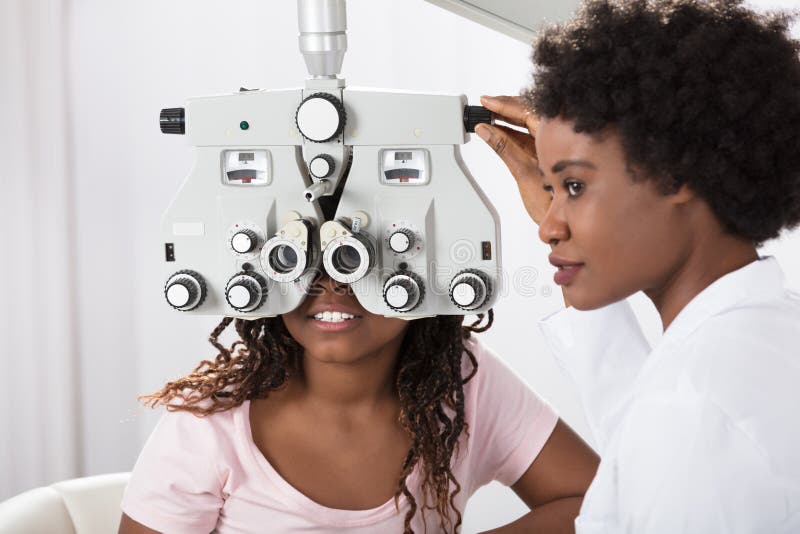Optometrist Doing Sight Testing for Patient Stock Image - Image of ...