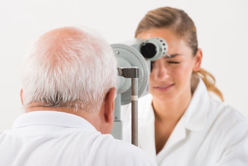 An Optometrist Doing Sight Testing for Patient Stock Photo - Image of ...