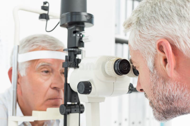 Optometrist Doing Sight Testing for Senior Patient Stock Image - Image ...